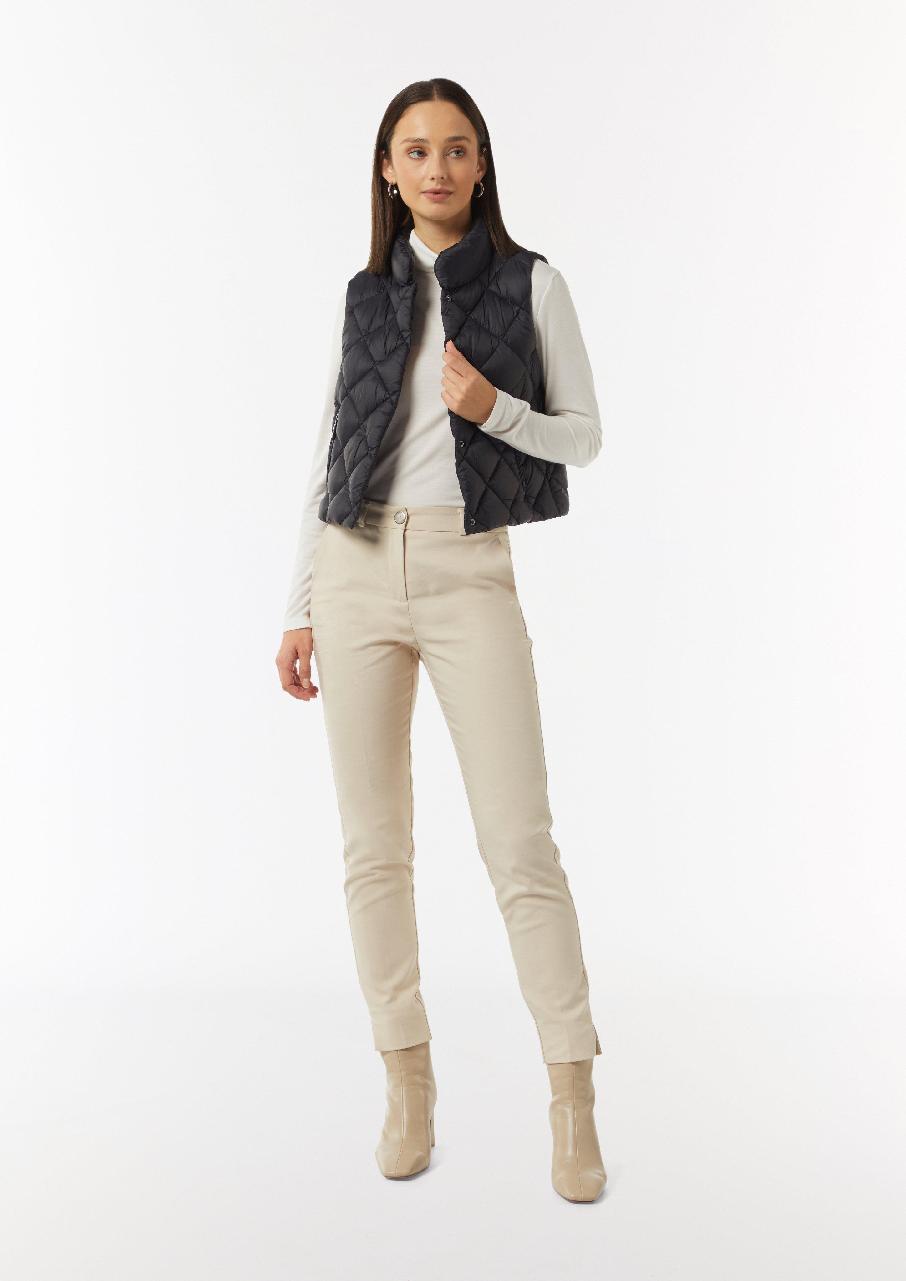 Boxy quilted body warmer with a stand-up collar - black | Comma